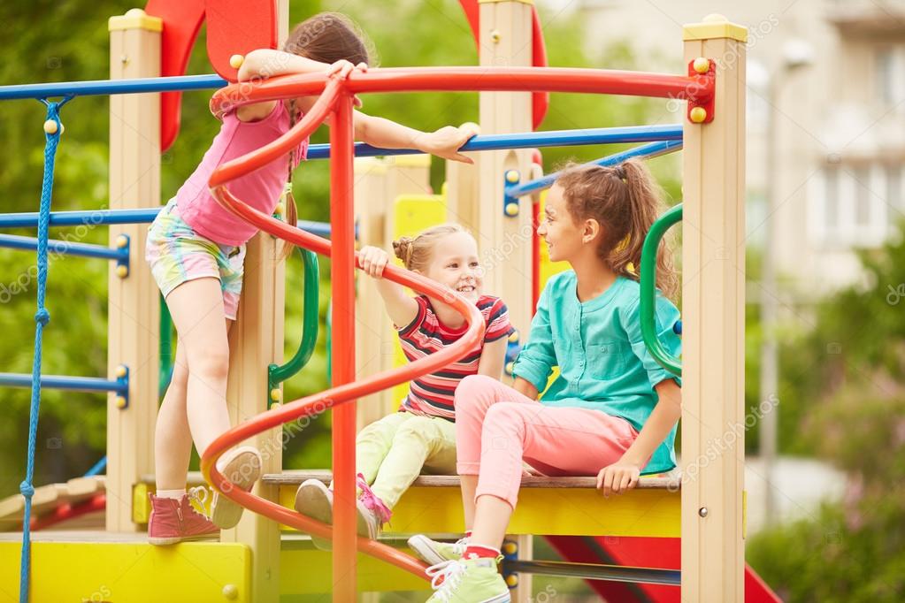 Happy children playing in the playground — Stock Photo © pressmaster ...