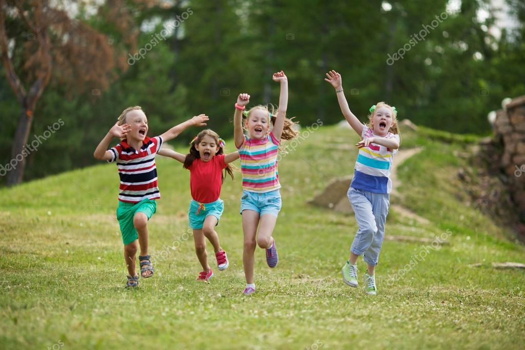 Ecstatic kids running Stock Photo by ©pressmaster 122103160