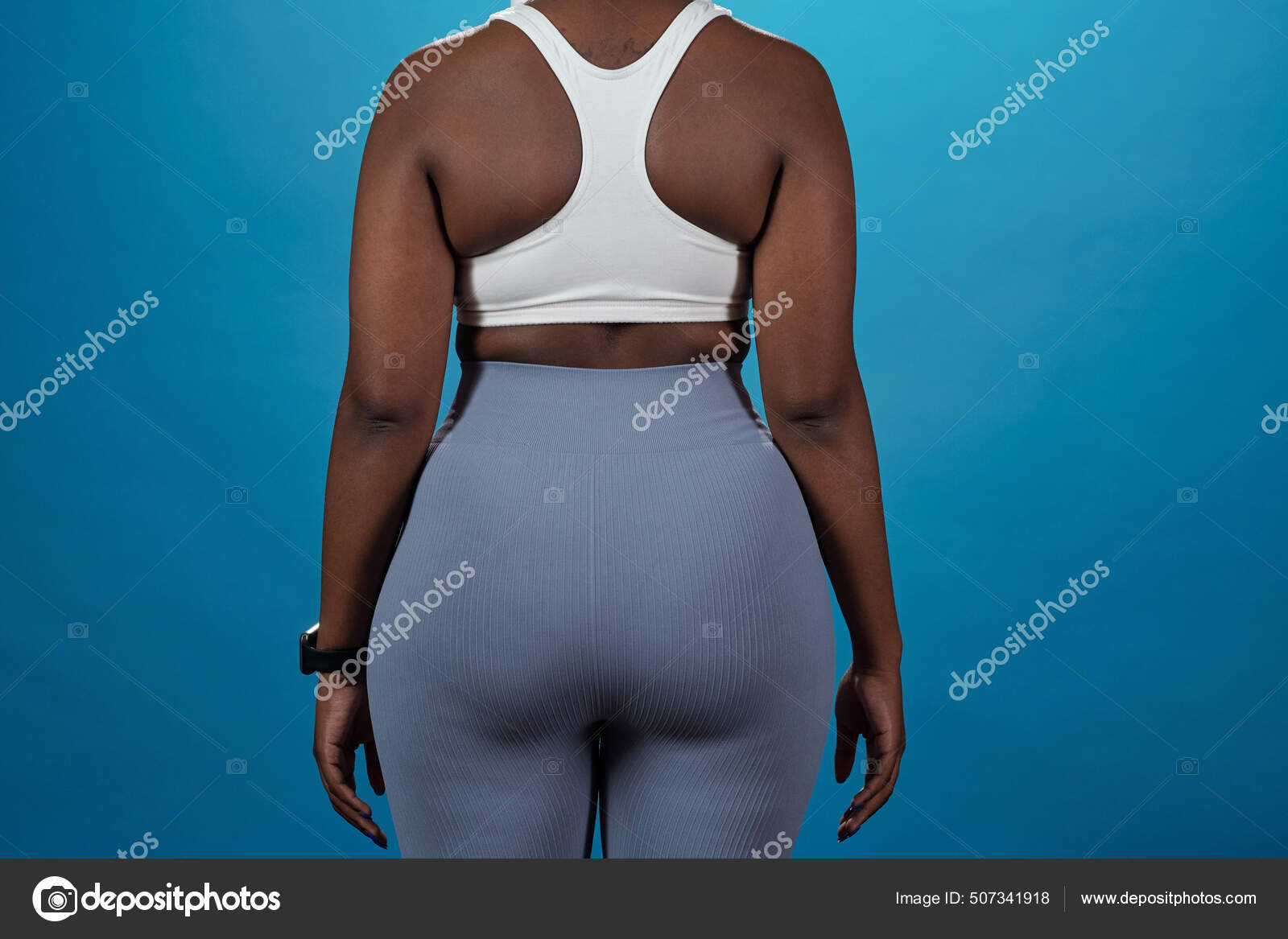 Rear view of young plus size female in activewear — Stock Photo ...