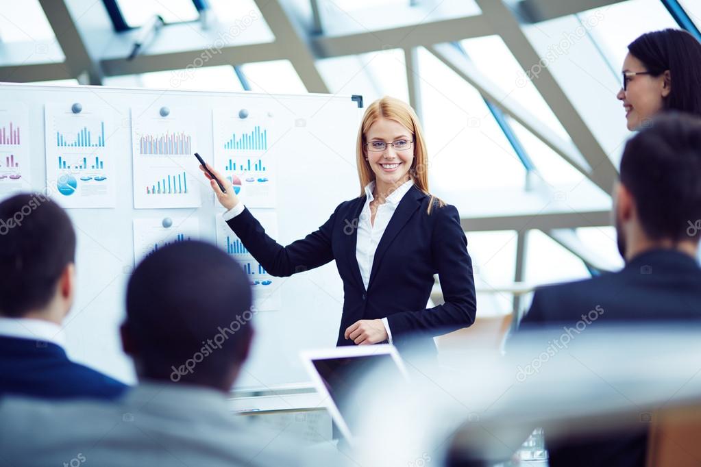Woman making presentation Stock Photo by ©pressmaster 69406375
