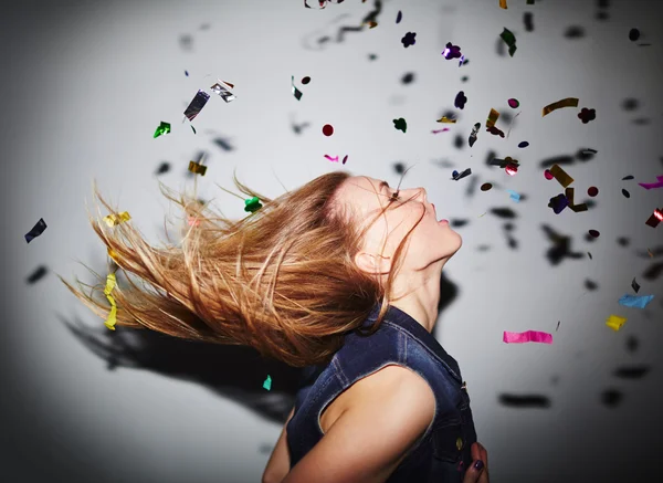 Woman dancing in nightclub with confetti - Stock Image - Everypixel