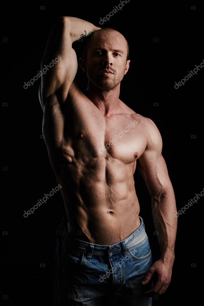 Torso of young muscular man Stock Photo by ©pressmaster 91652048