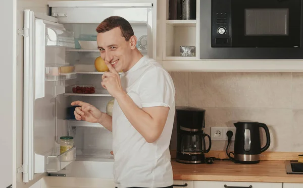 Man eating fridge Stock Photos, Royalty Free Man eating fridge Images ...