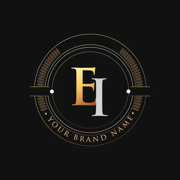 insignia inicial EI oro y color blanco, con sello y objeto circular ...