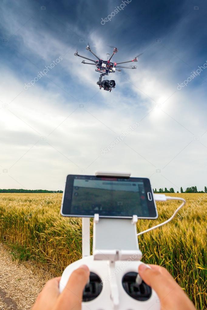 Unmanned copter. Man controls quadrocopter flight. — Stock Photo ...