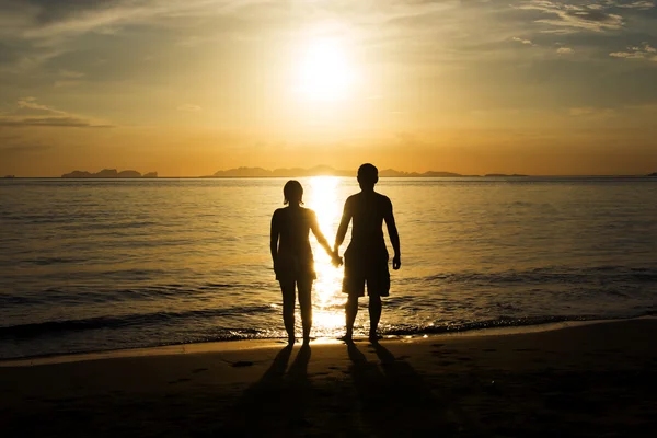 Romantic Scene of couples on the Beach with sunset — Stock Photo ...