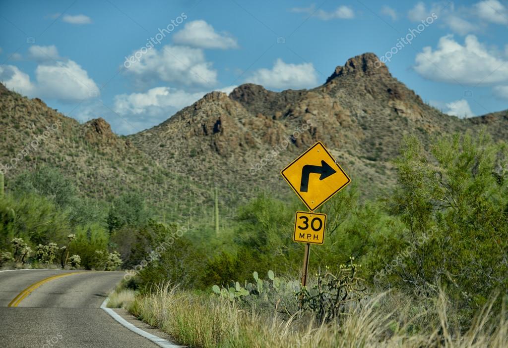 Sharp 30 mph turn on mountain road — Stock Photo © ftlaudgirl #88126744