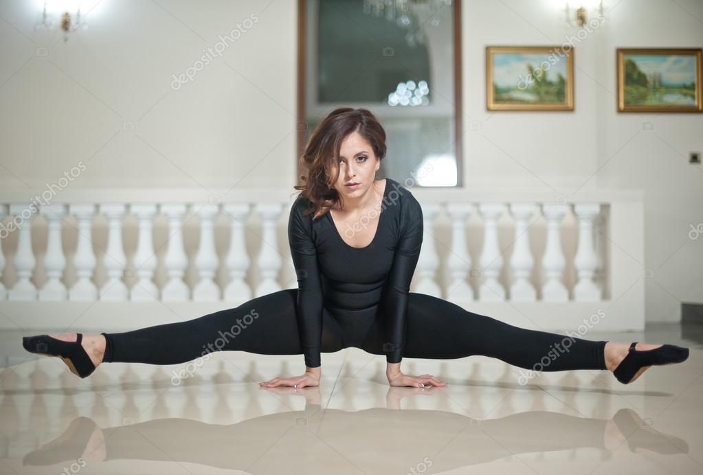 Graceful ballerina doing the splits on the marble floor. Gorgeous ...