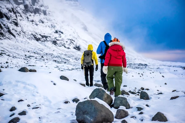 Group of climbers in snow mountains. — Stock Photo © surangastock #79123592