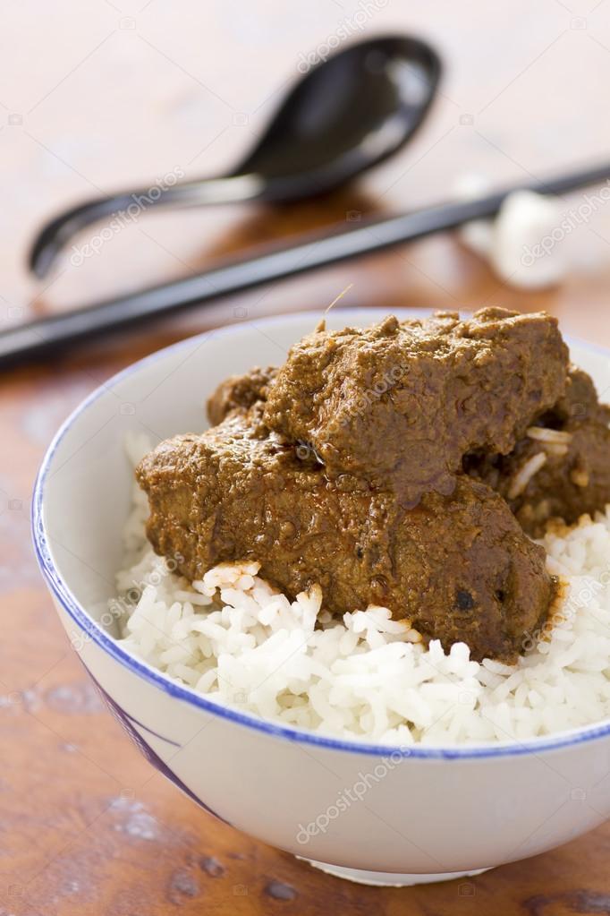 Chinese Styled Pork Rendang on steamed long grain rice. Non sharpened ...