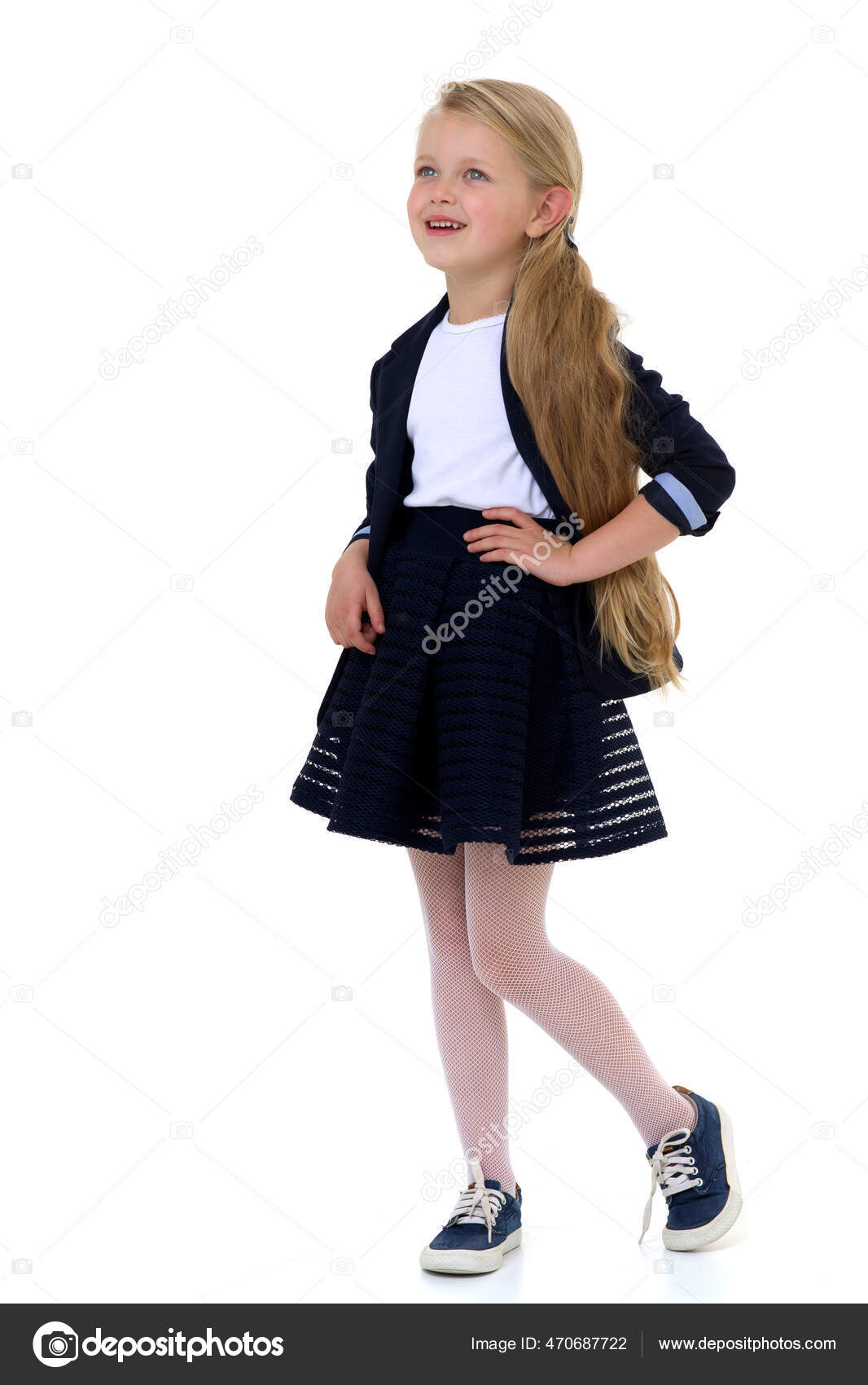 Blonde girl in school uniform. Isolated on white background Stock Photo ...