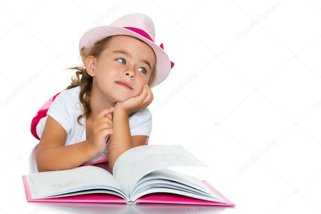 Little girl with a book Stock Photo by ©lotosfoto1 85130546