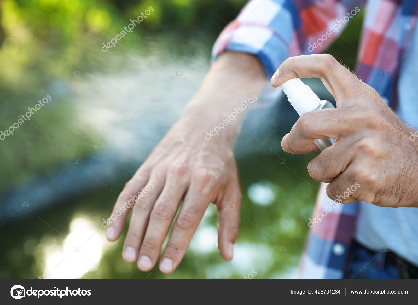 Man Applying Insect Repellent Hand Outdoors Closeup Stock Photo by ...