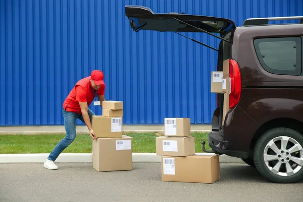 Courier Loading Packages Car Trunk Outdoors Stock Photo by ©NewAfrica ...