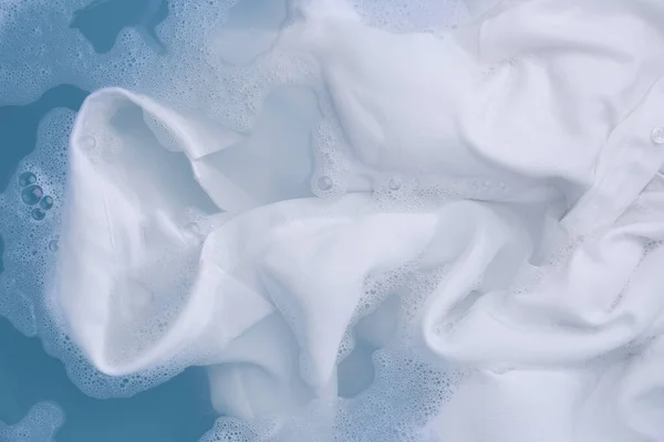 White clothing in suds, top view. Hand washing laundry - Stock Image ...
