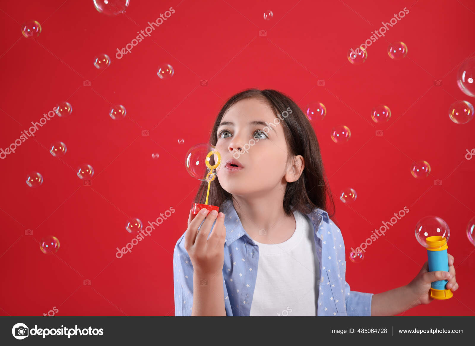 Little Girl Blowing Soap Bubbles Red Background Stock Photo by ©NewAfrica 485064728