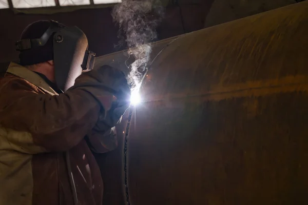 Welder performs welding large diameter pipe — Stock Photo © shinobi ...