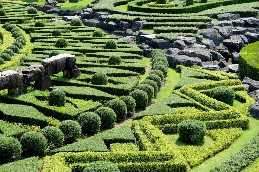 Garden path with topiary landscape Stock Photo by ©ponsulak 93548798