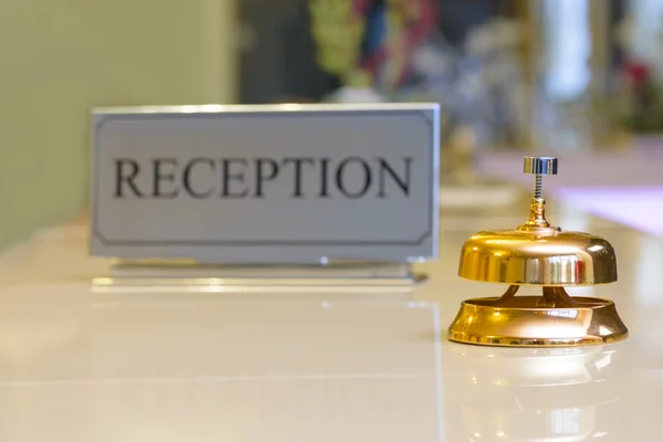 Bell with reception sign on front desk — Stock Photo © kataklinger ...