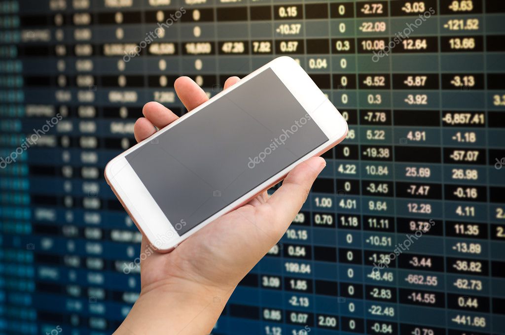 Smartphone on hand with stock market number — Stock Photo © CoffeeMate ...