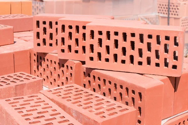 Wall ceramic perforated blocks of red bricks on a pallet Stock Photo by ...