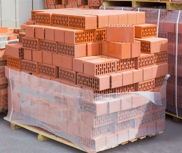 Wall ceramic perforated blocks of red bricks on a pallet Stock Photo by ...