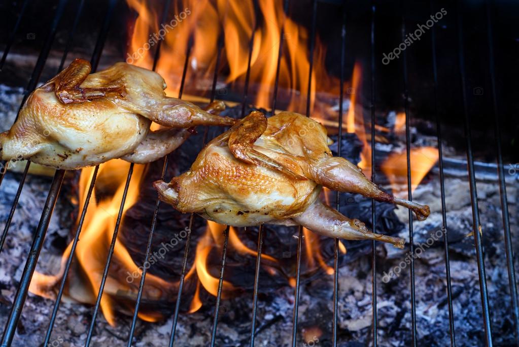 Grilling poultry quails in a restaurant — Stock Photo © pproman #120991780