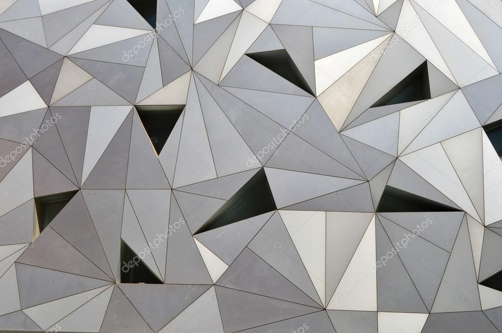 Facade with triangular windows — Stock Photo © claverinza #74100741