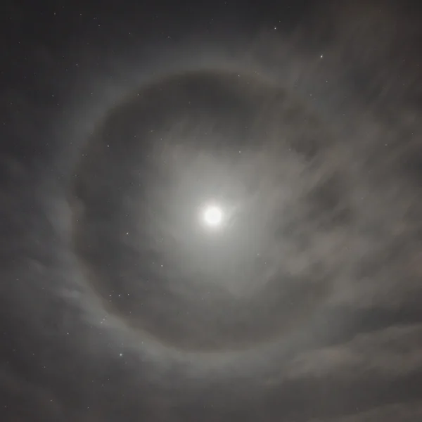 Natural phenomenon in the night sky. Moon halo - Stock Image - Everypixel