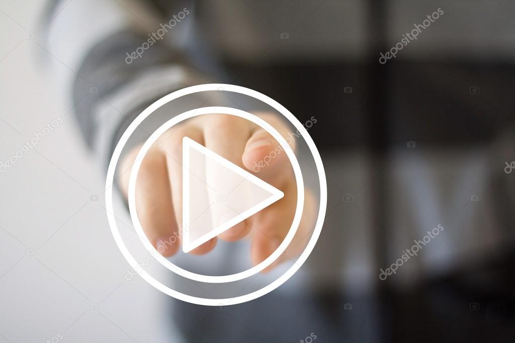 Businessman hand press play button icon — Stock Photo © maxsim #60832793