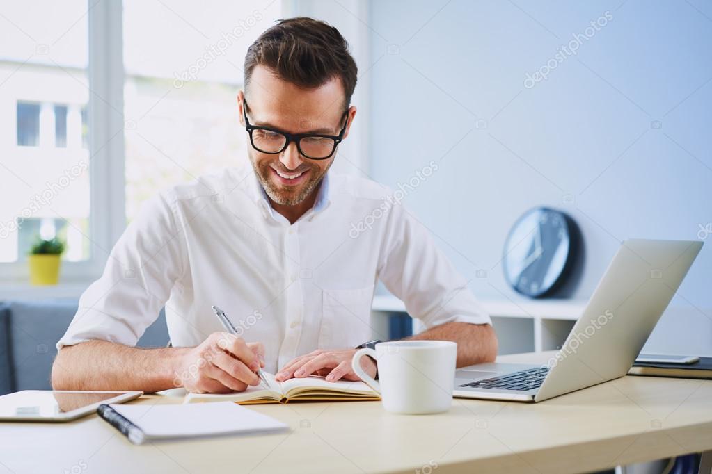 Happy man working Stock Photo by ©baranq 115186226