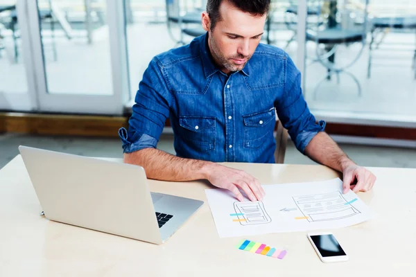 Web designer working on a responsive design - Stock Image - Everypixel