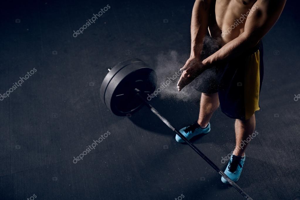 Athlete getting ready for weight lifting Stock Photo by ©baranq 88058358