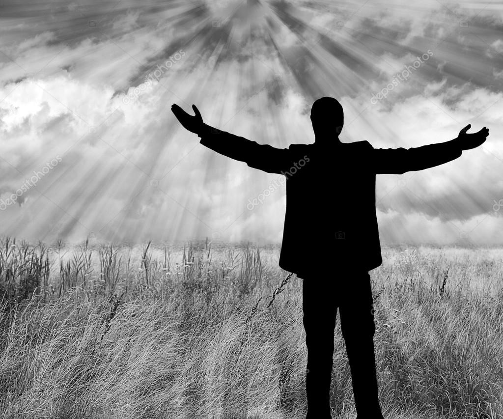 Religious illustration of silhouette of man Praising God Stock Photo by ...