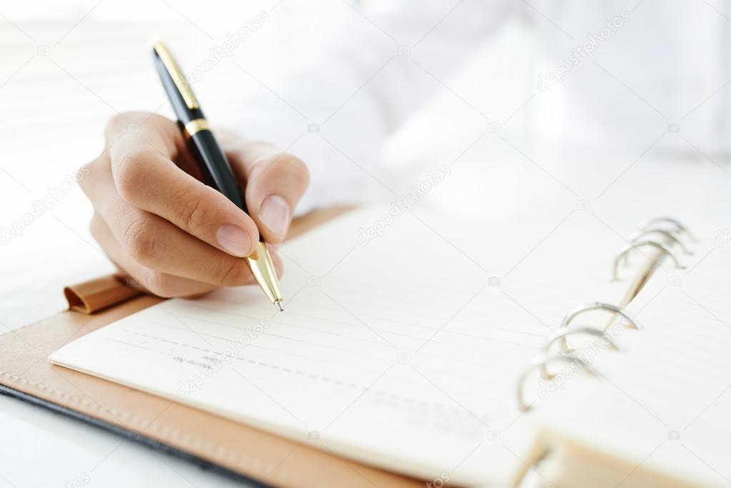 Male hand making notes — Stock Photo © DragonImages #101130980