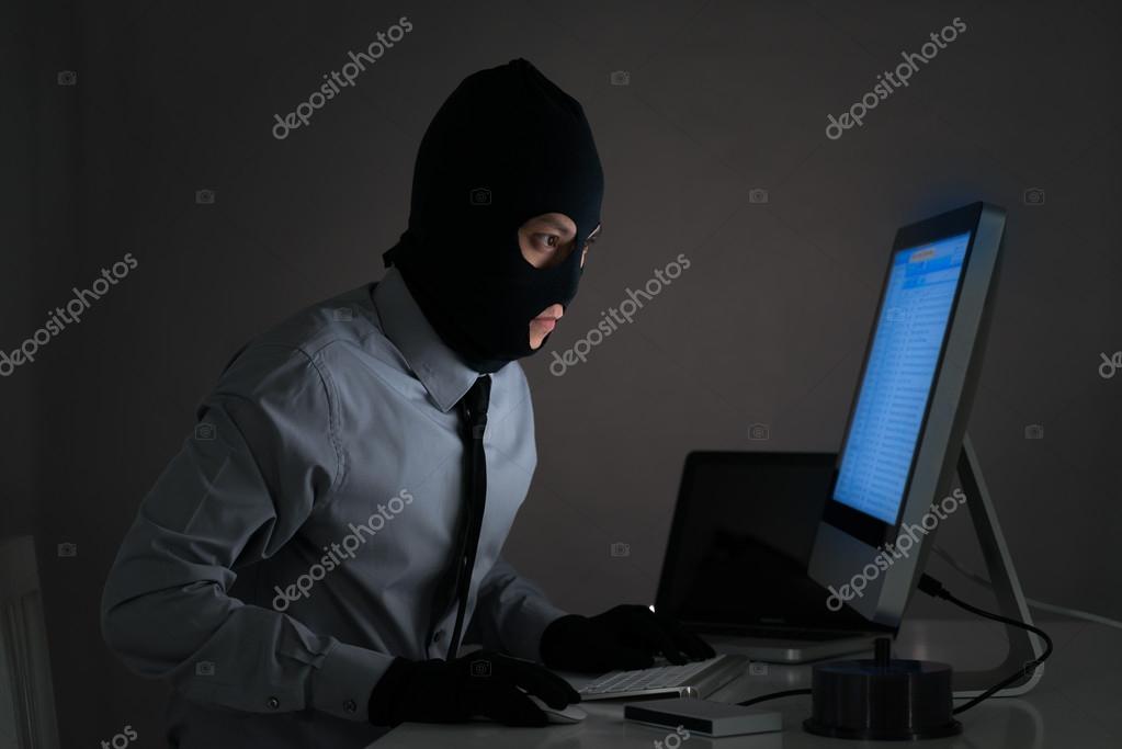 Man stealing information from the computer ⬇ Stock Photo, Image by ...