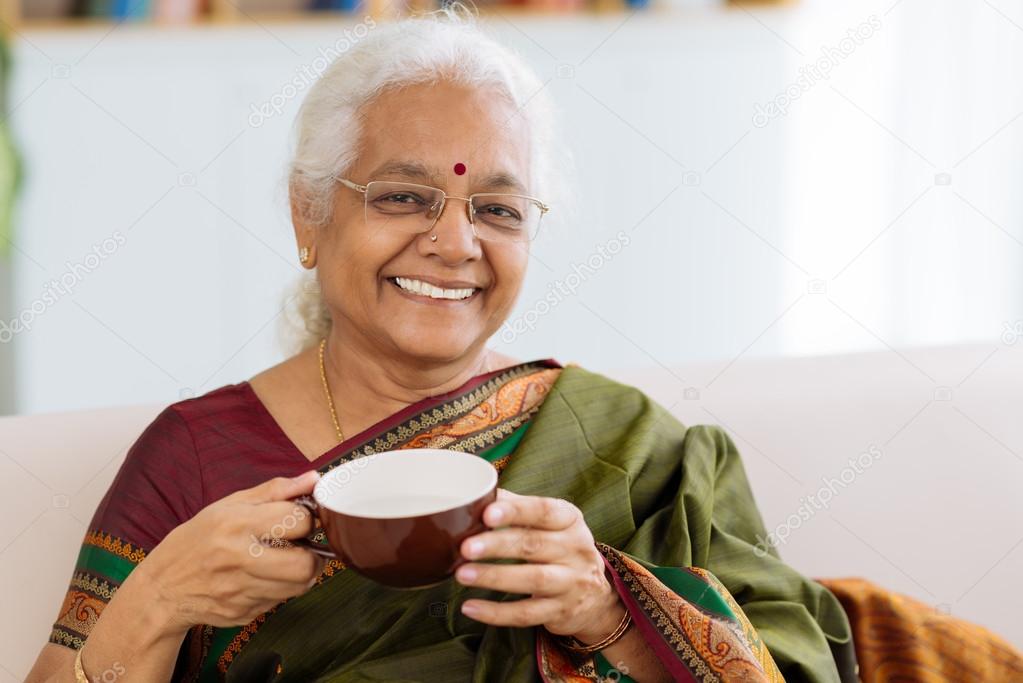 Cheerful Indian lady — Stock Photo © DragonImages #61048451
