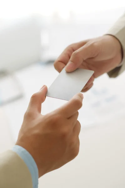 Giving business card — Stock Photo © DragonImages #66510067