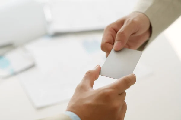 Giving business card — Stock Photo © DragonImages #66510067
