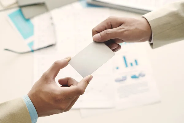 Giving business card — Stock Photo © DragonImages #66510067