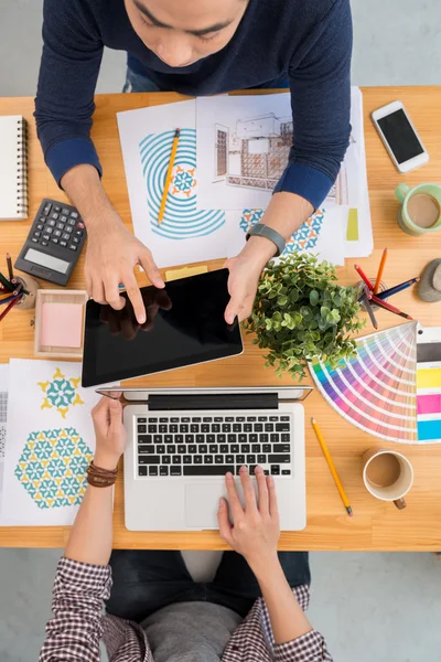 Designers at work over room design - Stock Image - Everypixel