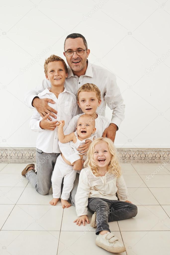 Single father and his children — Stock Photo © DragonImages #90272812