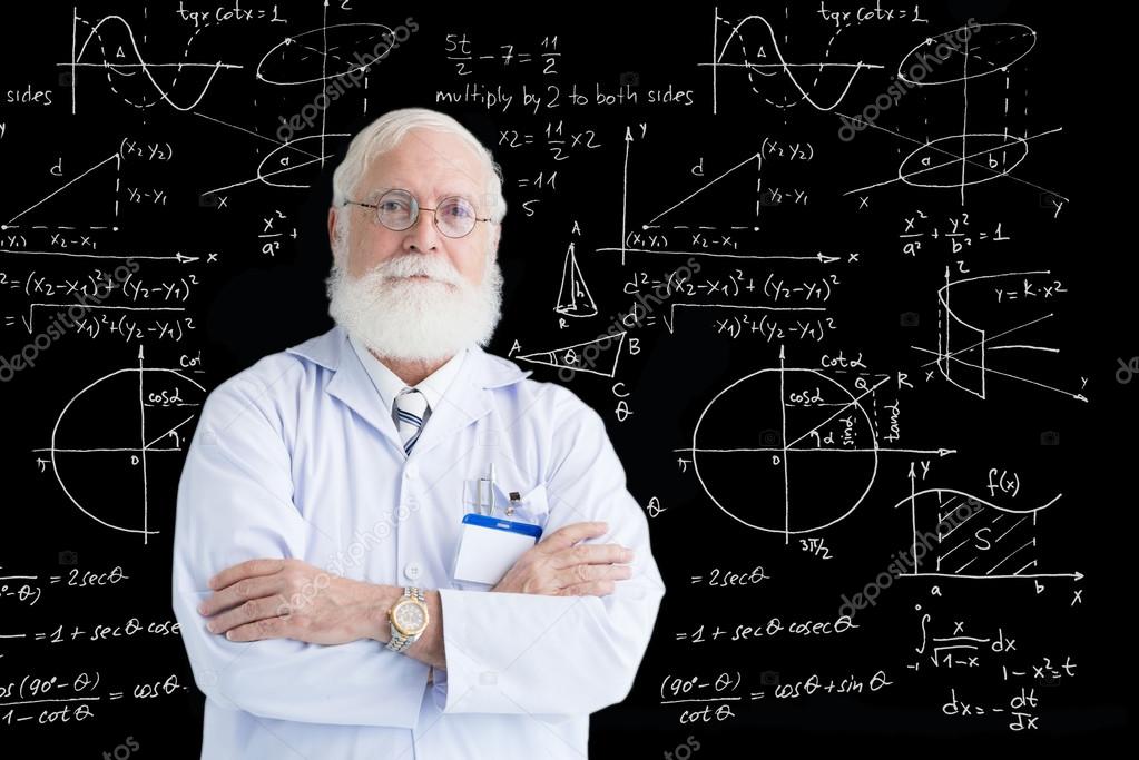 Senior scientist standing at blackboard — Stock Photo © DragonImages ...