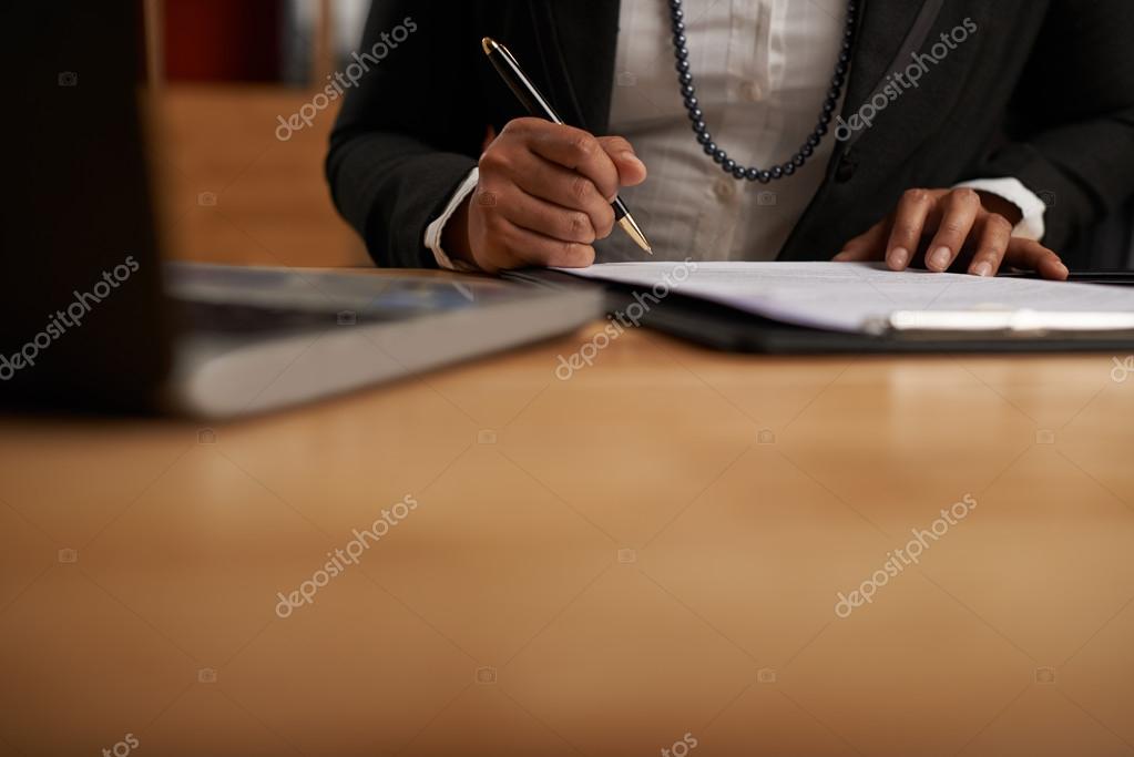 Business lady signing contract Stock Photo by ©DragonImages 92649226