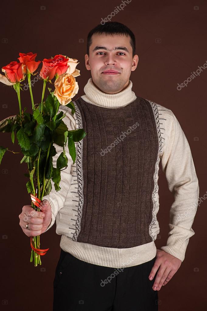 Attractive man with a bouquet of roses Stock Photo by ©Dualshock 64234799