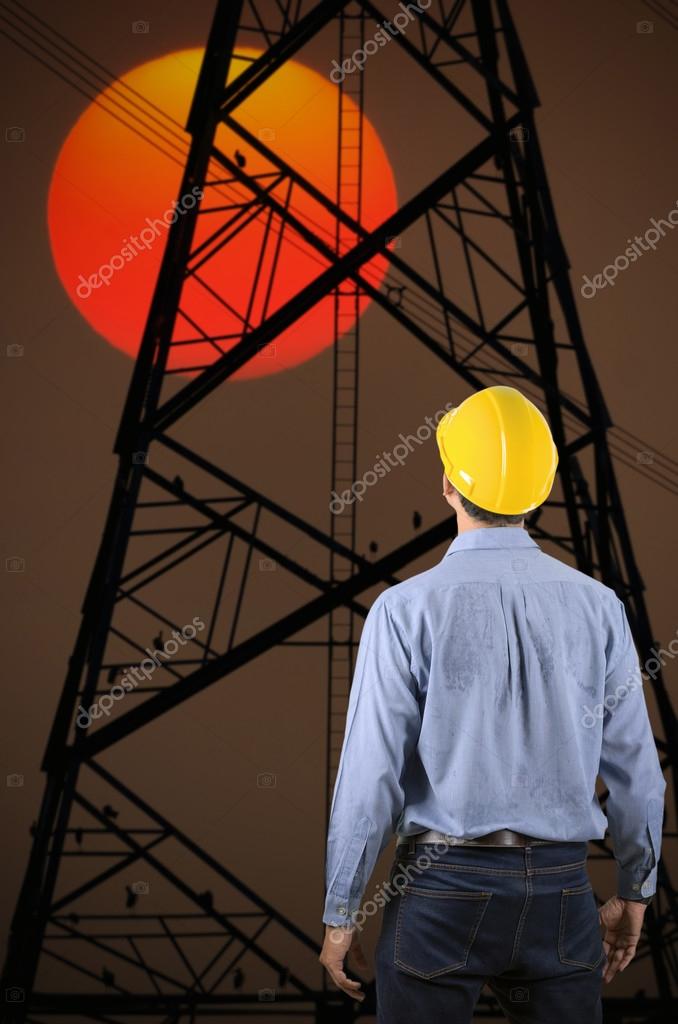 Engineer near transmission tower. — Stock Photo © nirutdps #75371871
