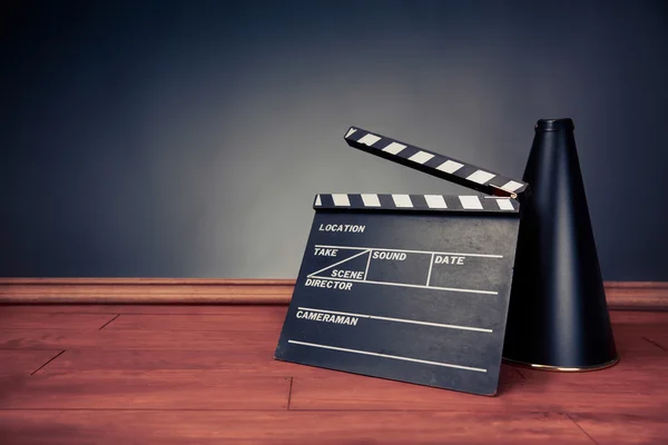 Filmmaking scene with dramatic lighting, movie reel Stock Photo by ...