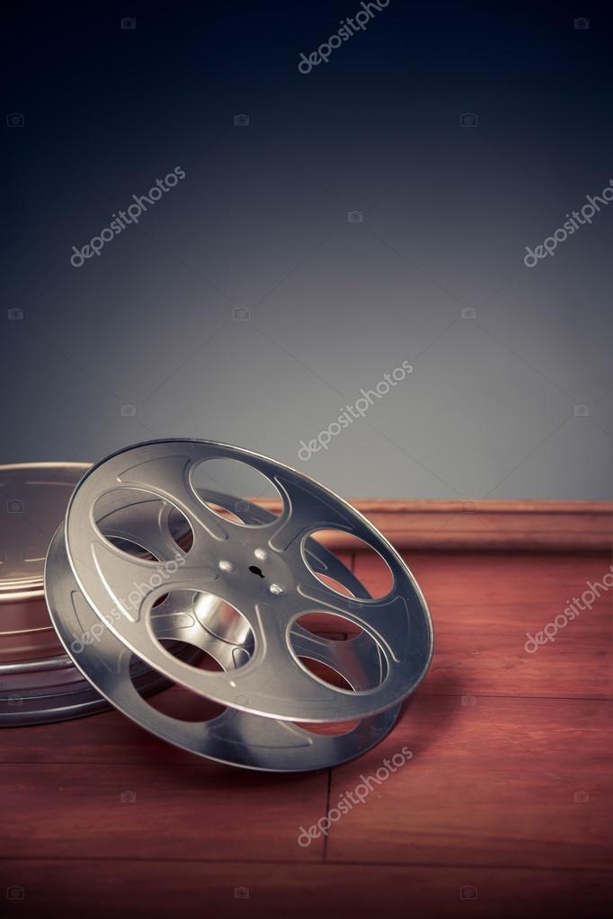 Filmmaking scene with dramatic lighting, movie reel Stock Photo by ...