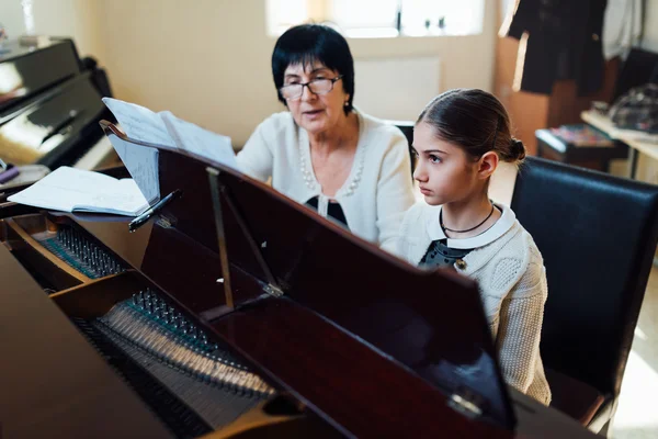 piano lessons at music school, teacher and student. - Stock Image ...