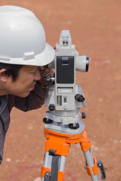 Engineers use tacheometer or theodolite for survey line columns - Stock ...